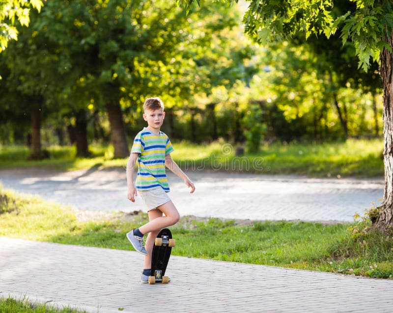 Boy riding a skateboard stock photo. Image of equipment - 106162722