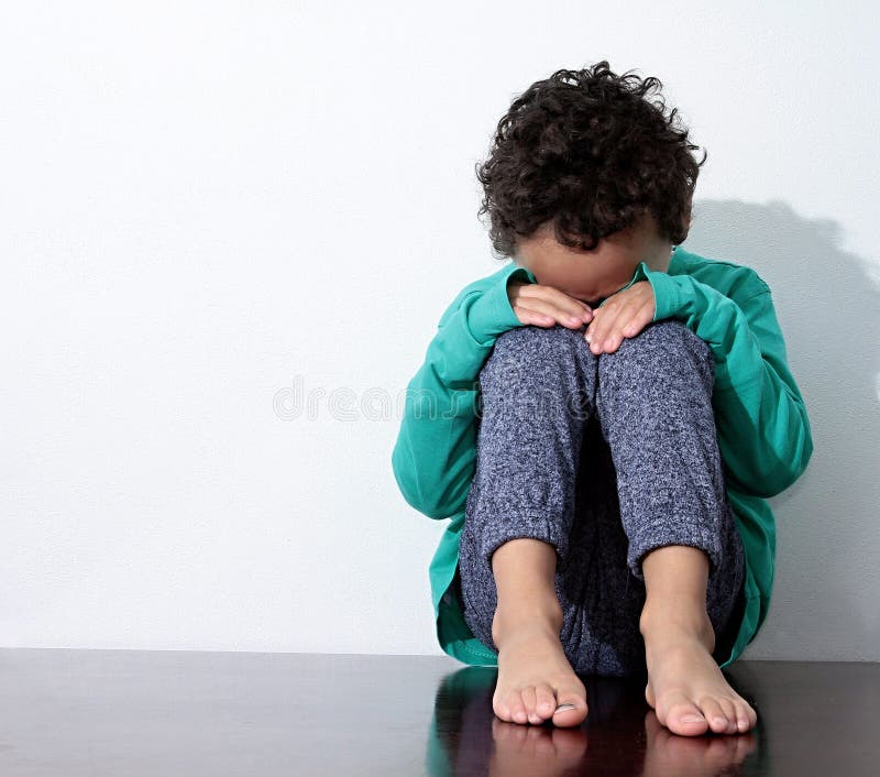 Boy Crying in Poverty with Hand Over Face Stock Photo Stock Photo ...