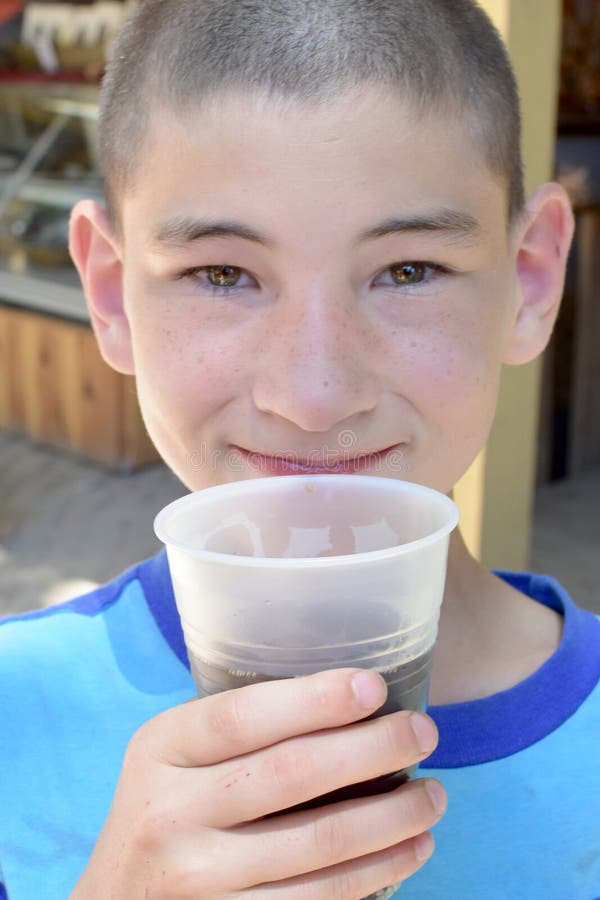 Boy with Cup of Soda Pop stock image. Image of plastic - 97001101