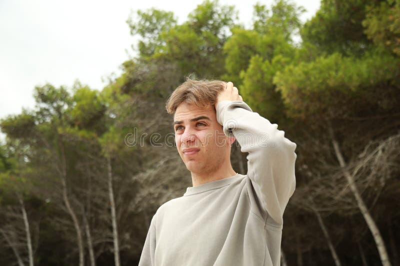 Boy with Curiosity Expression on Face Outdoors in Forest Stock Photo ...
