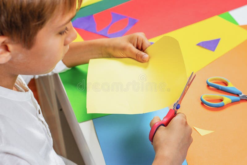 Kid Cutting Colored Paper with Scissors. Education, Learning, Paper ...