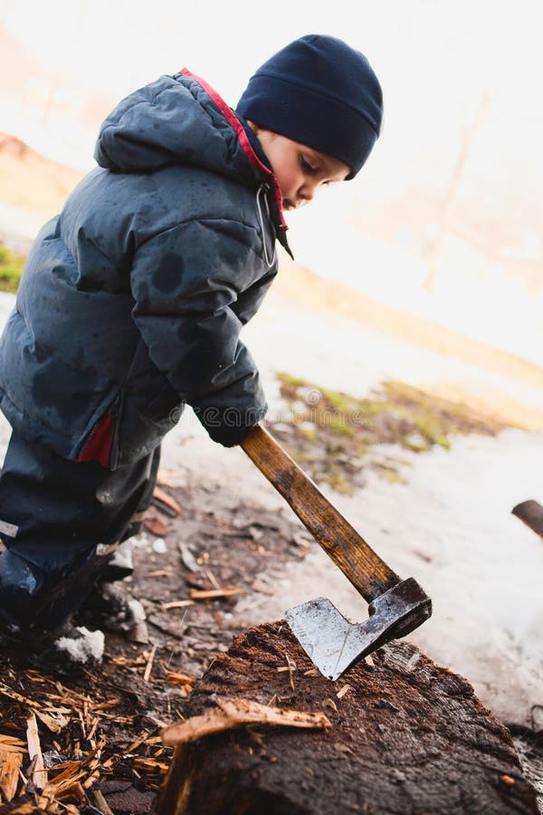 Boy cutting wood stock image. Image of stack, cutting - 23331313