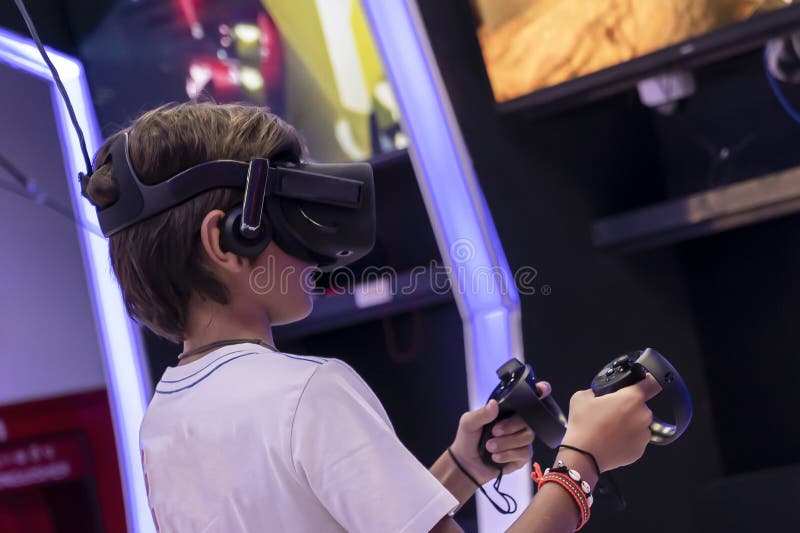 A Boy with 3d Glasses Plays a Game in Virtual Reality in a Slot Machine ...