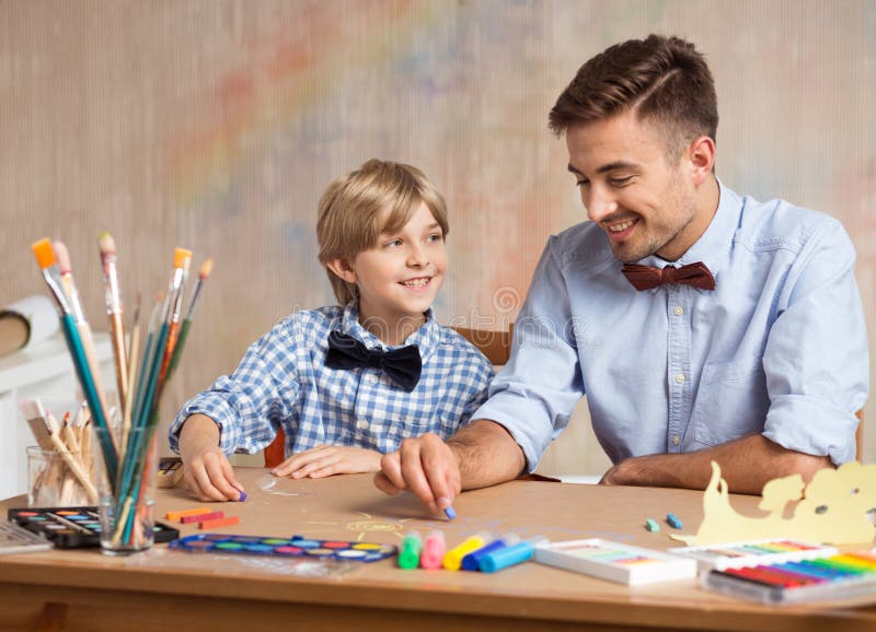 Boy and Dad Painting Together Stock Image - Image of paintbrush ...