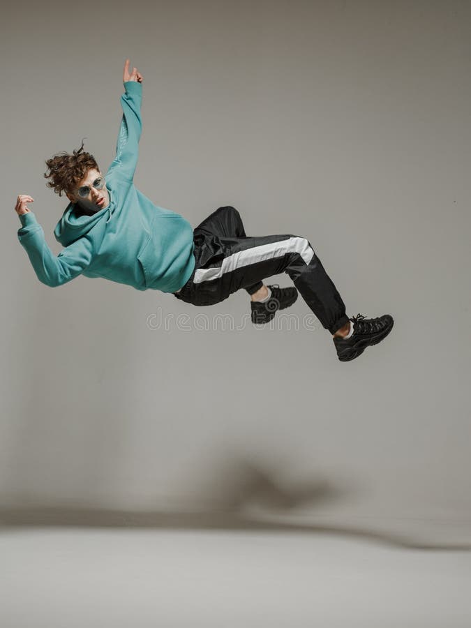 Boy Dancing Breakdance Mid-air in Studio. Acrobatic Dancer. Stock Image ...