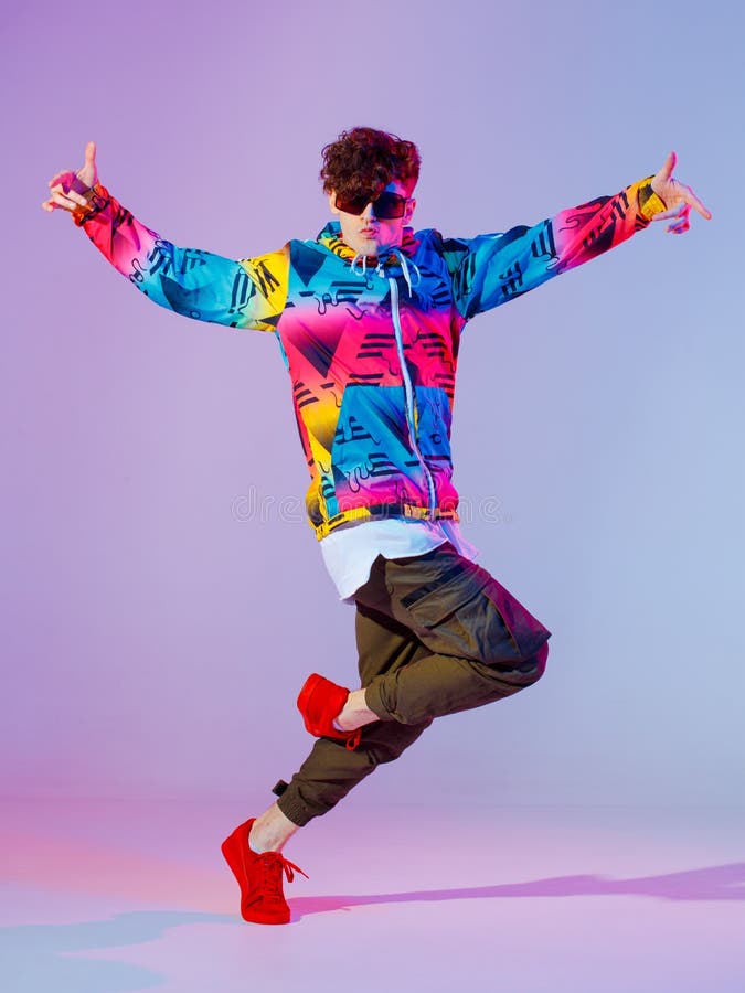 Boy Dancing In Neon Light Studio. Acrobatic Dancer. Stylish Flex. Stock ...