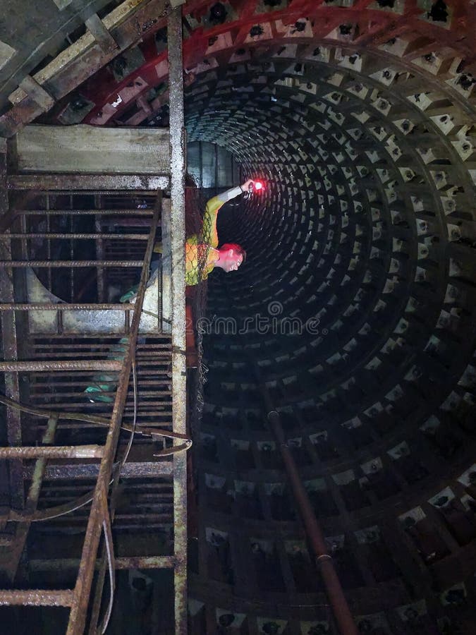A Boy Digger Poses with a Lantern in the Mine of an Underground Sewage ...