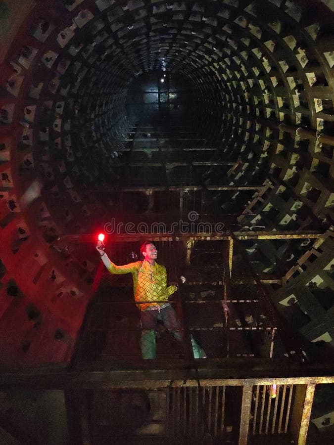 A Boy Digger Poses with a Lantern in the Mine of an Underground Sewage ...