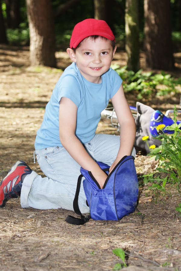 Child putting waste in bin stock photo. Image of garbage - 8578410