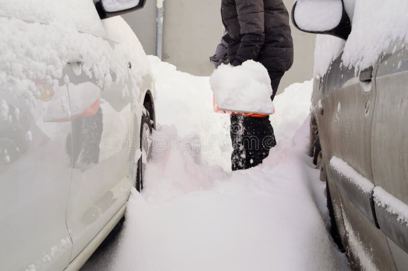 The Boy is Digging the Car Out of the Snow Stock Photo - Image of ...