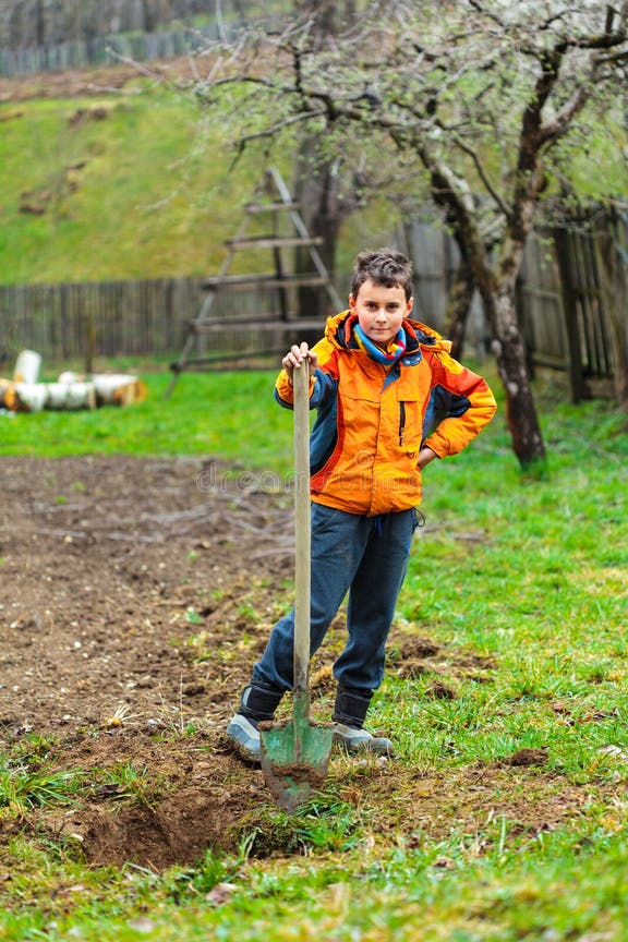 Boy digging in the ground stock image. Image of digging - 24325127