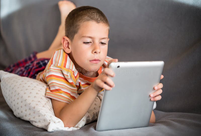 Boy with digital tablet stock image. Image of tablet - 61813983