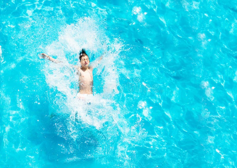 Boy Dive and Falls into the Pool Water Backwards Stock Image - Image of ...