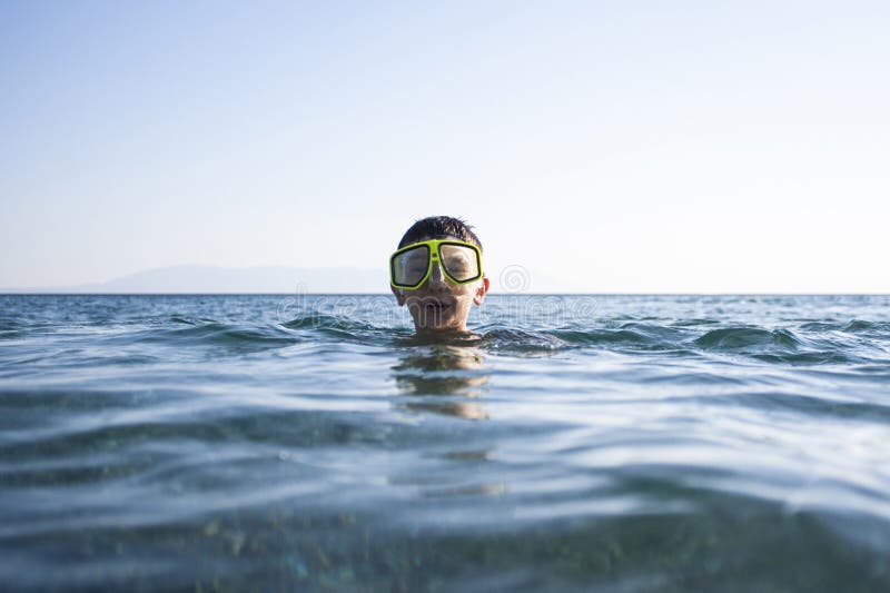 Boy with diving goggles. stock image. Image of water - 56595761