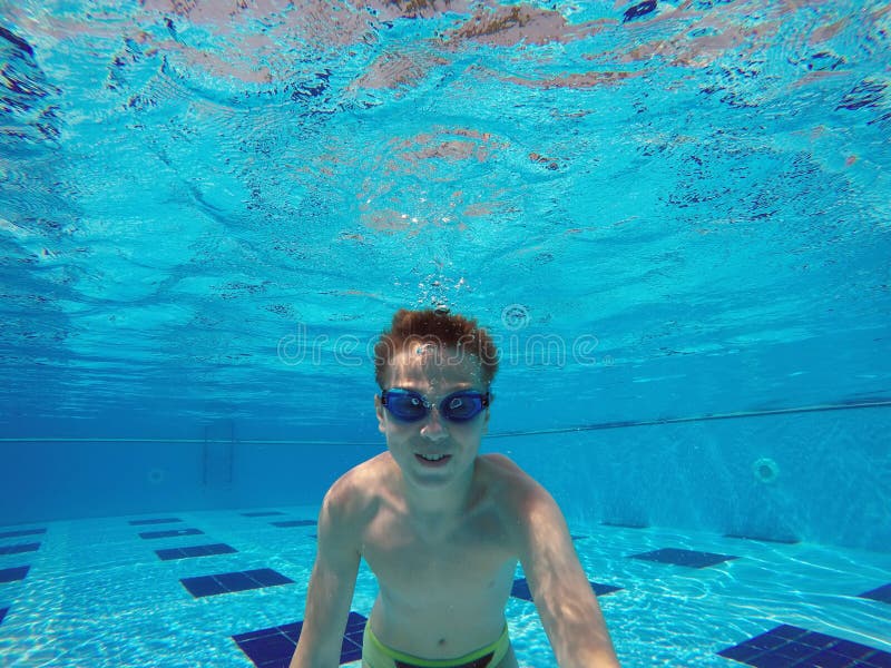 Boy Diving into a Swimming Pool Stock Image - Image of child, young ...