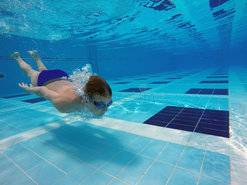 Boy Diving into a Swimming Pool Stock Image - Image of summer, person ...