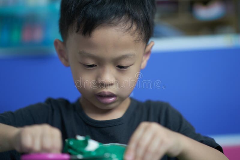 Boy Do Paper Art Work Activity in School Class Stock Image - Image of ...