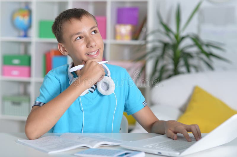 Boy Does Homework with a Laptop at a Desk Stock Image - Image of manner ...