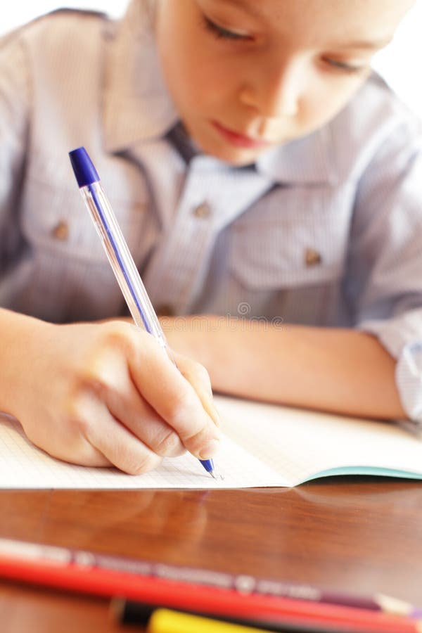 Boy does a lesson stock image. Image of paper, preschooler - 15061013