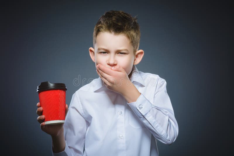 Boy Does Not Want To Drink Coffee. The Child Does Not Like The Beverage ...