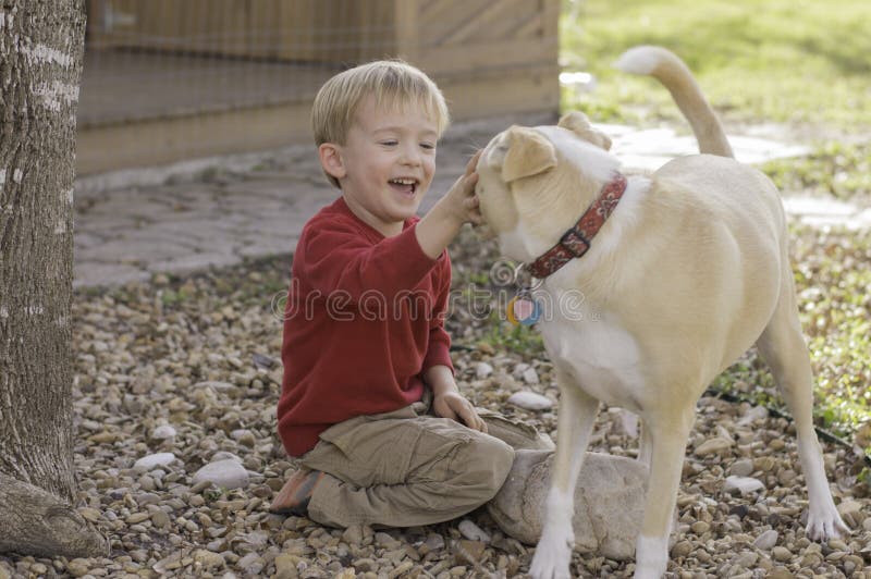 Boy with Dog stock image. Image of outdoors, petting - 53448153