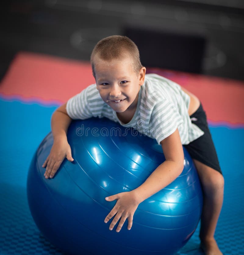 Boy Doing Exercises with Ball Stock Photo - Image of child, action ...