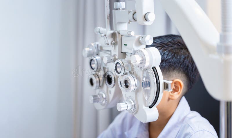 Boy Doing Eye Test Checking Examination with an Optometrist in the ...