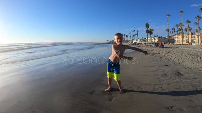 Boy Doing Floss on Beach stock footage. Video of celebration - 216364726
