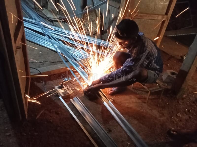 A Boy is Doing Grinding Work in a Shop in India Editorial Photo - Image ...