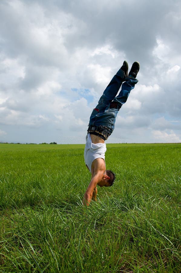 Boy Doing a Handstand stock image. Image of grass, down - 3106869