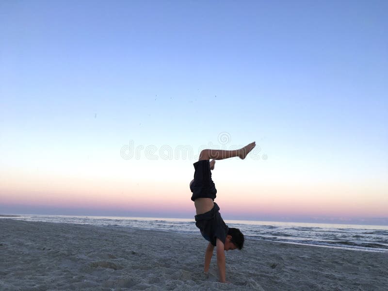 Boy Doing Handstand on Beach Stock Image - Image of handstand, outdoor ...