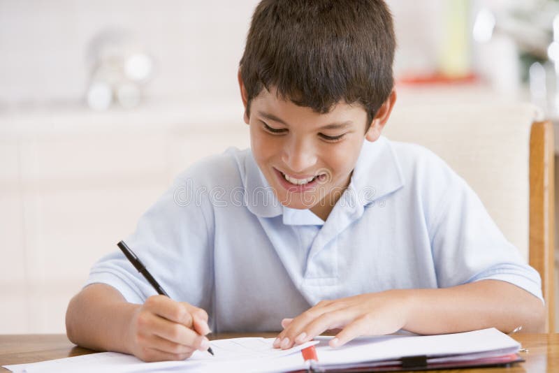 Boy Doing His Homework stock photo. Image of horizontal - 6441710