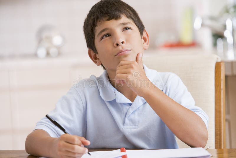 Boy Doing His Homework stock image. Image of teen, thinking - 6441715