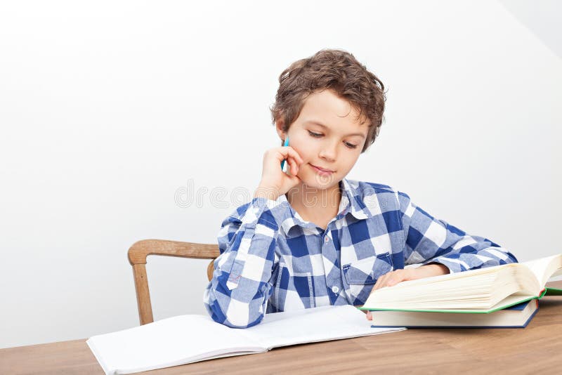 A Boy is Doing His Homework Stock Photo - Image of caucasian, teenager ...