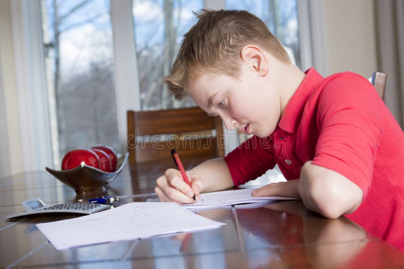 Boy Doing His Homework at Home Stock Photo - Image of homework, teen ...