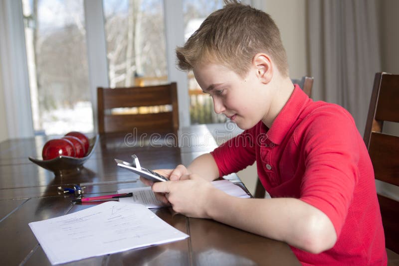 Boy Doing His Homework at Home Stock Photo - Image of school, teen ...