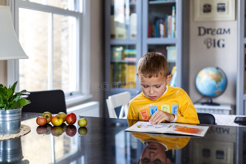 Boy doing his homework stock image. Image of elementary - 78895355