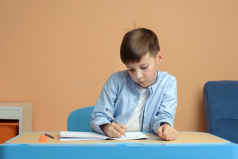 Boy doing home task stock photo. Image of education - 173746408