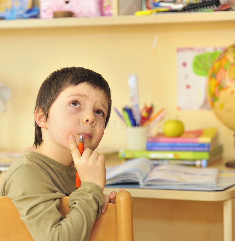 Boy doing homework stock photo. Image of desk, pensive - 18164656