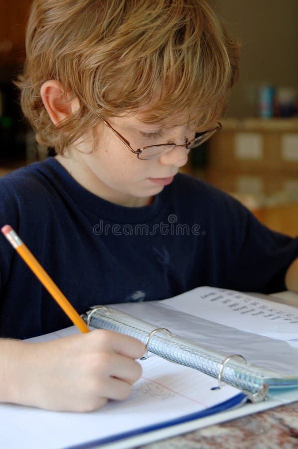 Boy doing homework stock photo. Image of write, busy, male - 6371828