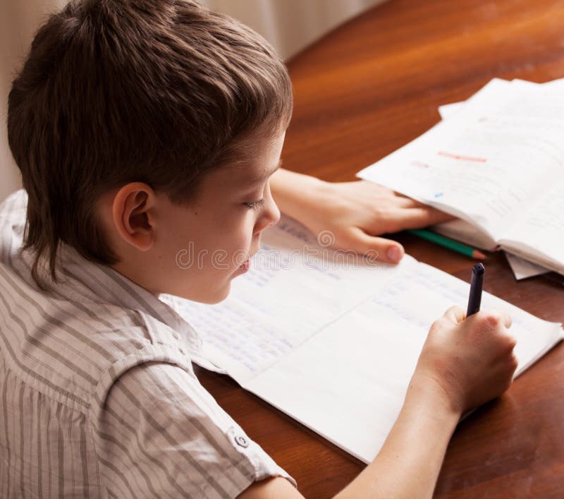Boy doing homework stock image. Image of homework, elementary - 142037519