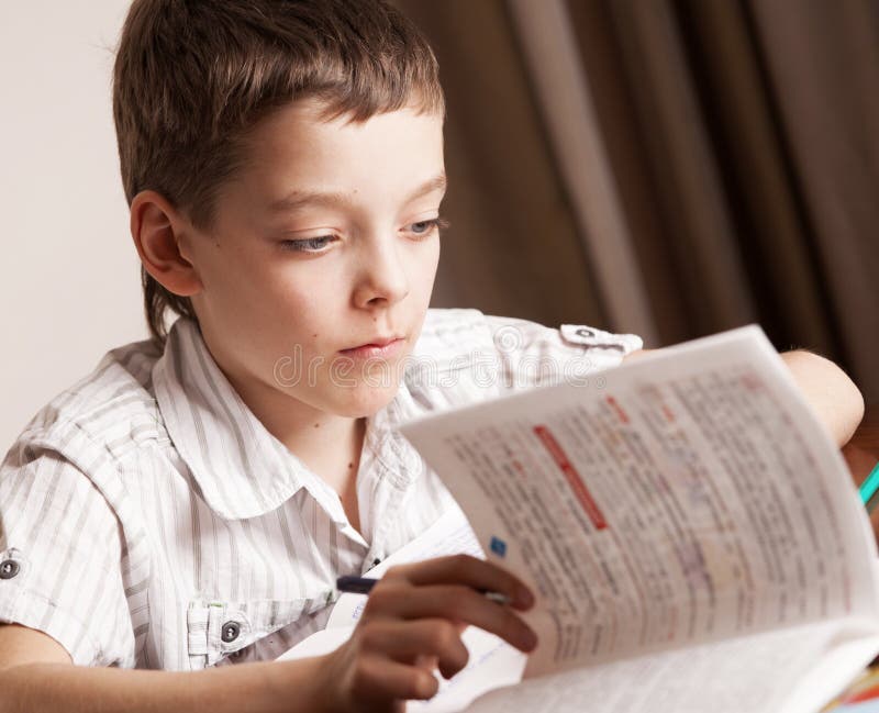 Sad boy doing homework stock photo. Image of problem - 44531744