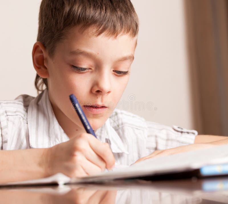 Boy doing homework stock photo. Image of portrait, children - 95864818