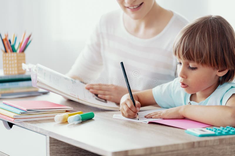 Boy Doing Homework and Exercise with Teacher Stock Photo - Image of ...