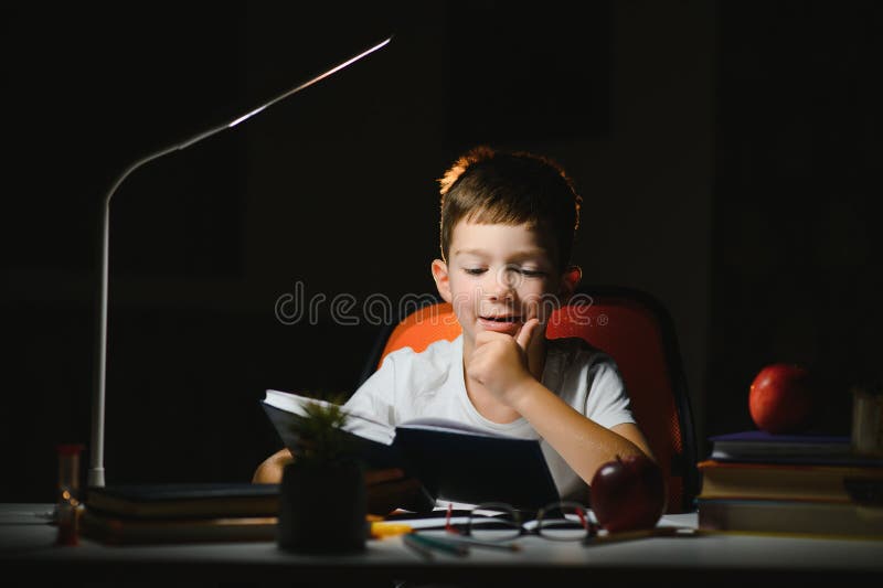 Boy Doing Homework at Home in Evening Stock Image - Image of cute, lamp ...
