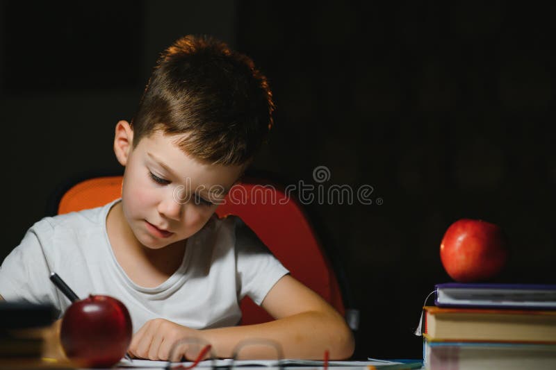 Boy Doing Homework at Home in Evening Stock Image - Image of home ...