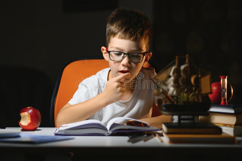 Boy Doing Homework at Home in Evening Stock Image - Image of portrait ...
