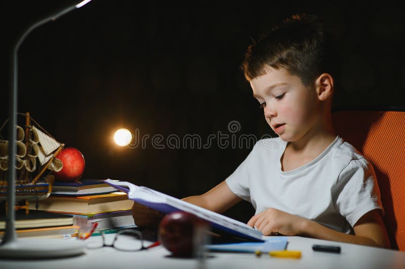 Boy Doing Homework at Home in Evening Stock Image - Image of homework ...