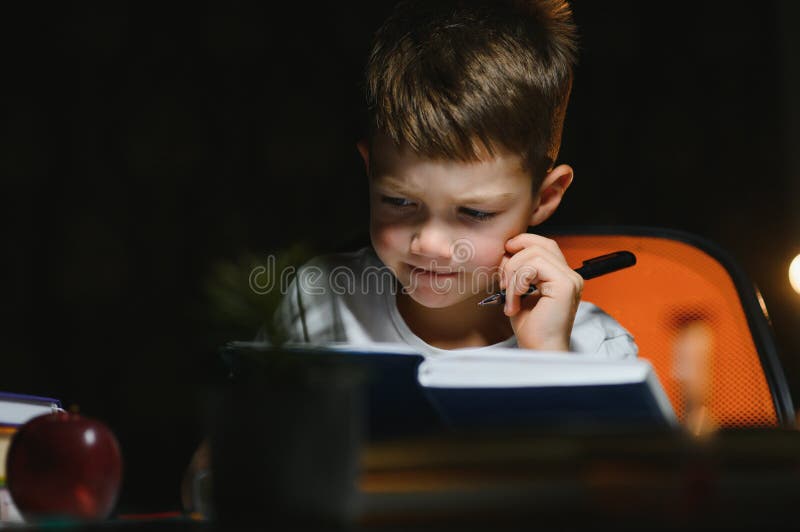 Boy Doing Homework at Home in Evening Stock Photo - Image of child ...