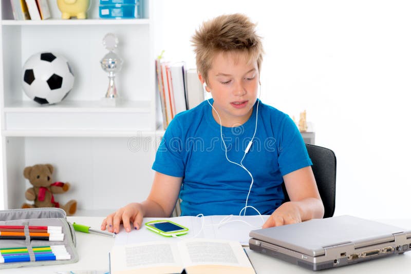 Boy is Doing Homework and Listening Music Stock Image - Image of ...
